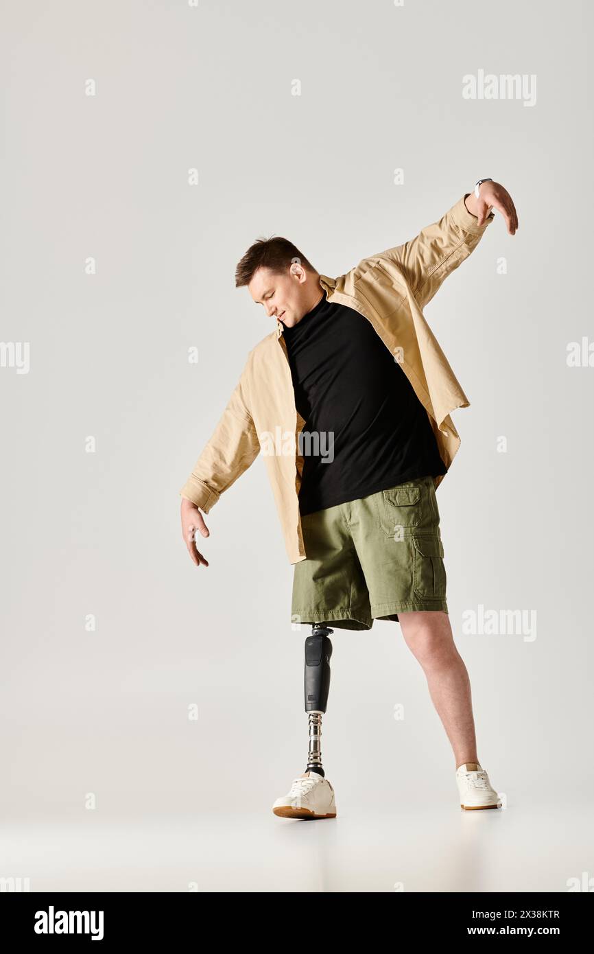 A handsome man with a cast on one leg and a prosthetic on the other ...