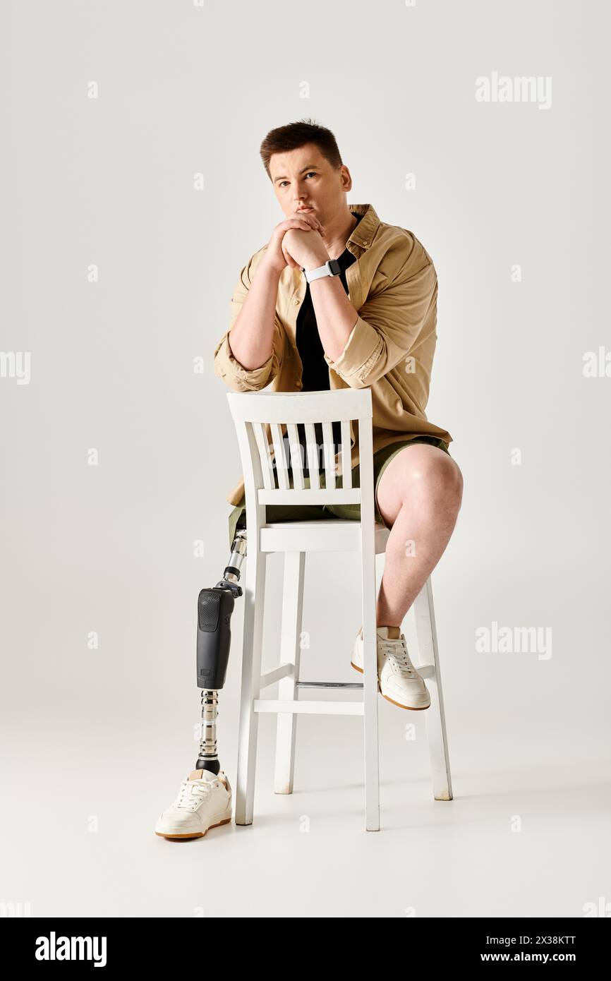 A handsome man with a prosthetic leg showcases dynamic poses on a white ...
