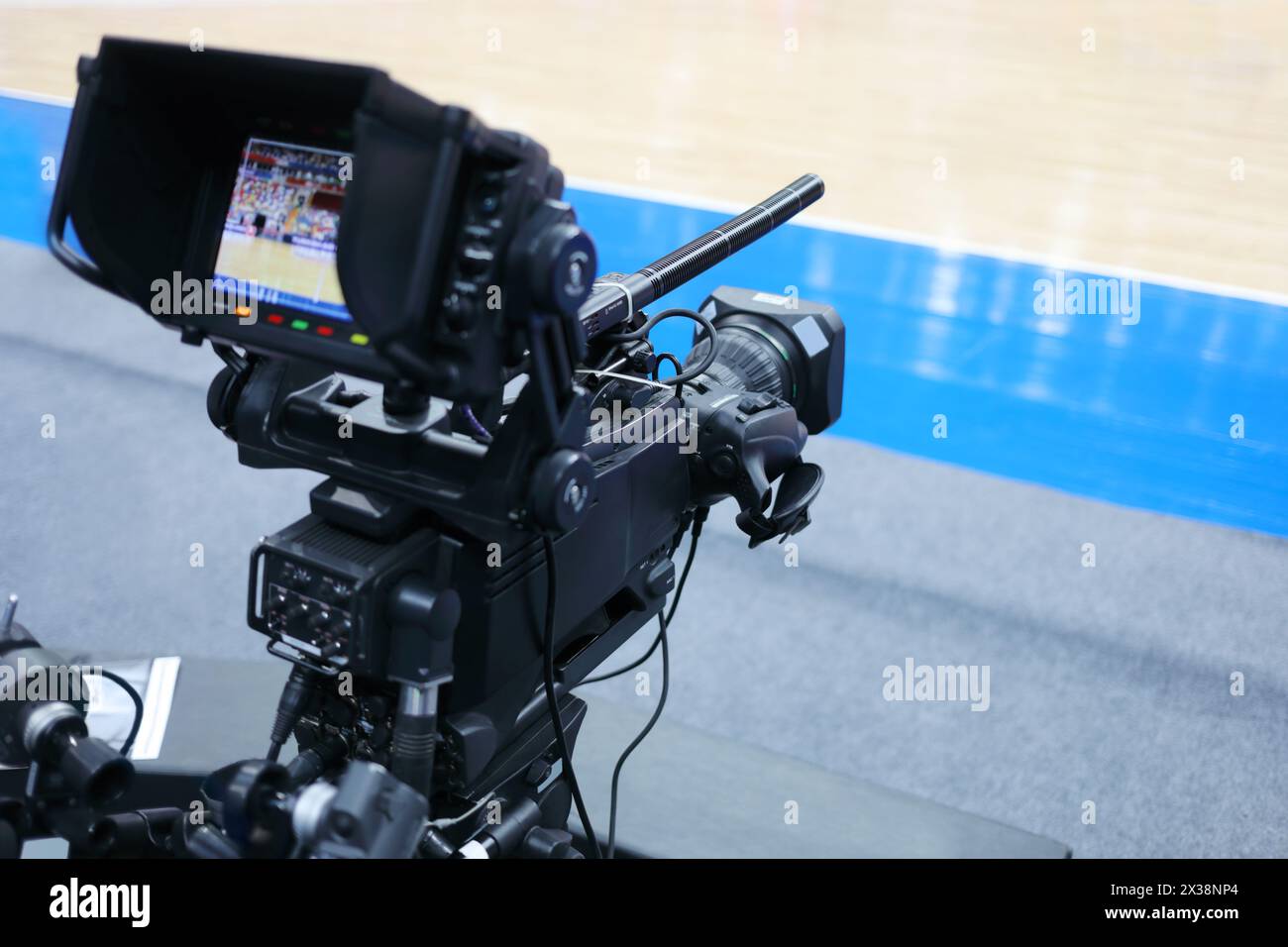 Professional camera with microphone at basketball game in modern ...