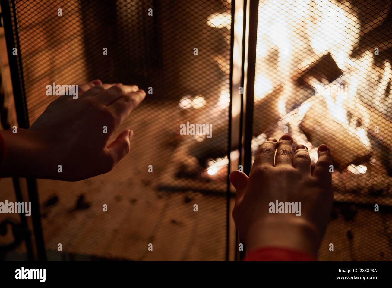Person warming his hands at open fire hi-res stock photography and ...