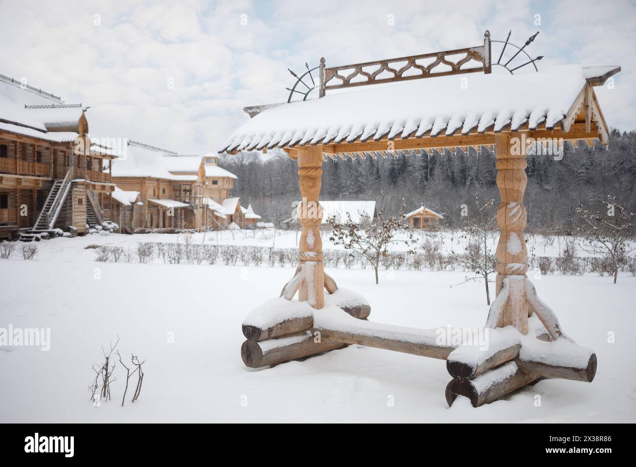 Wooden old-style bench, log buildings in Russian Orthodox Monastery at ...