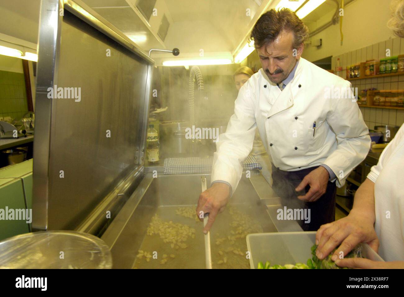the cook or chef working in the kitchen working in the kitchen Stock ...