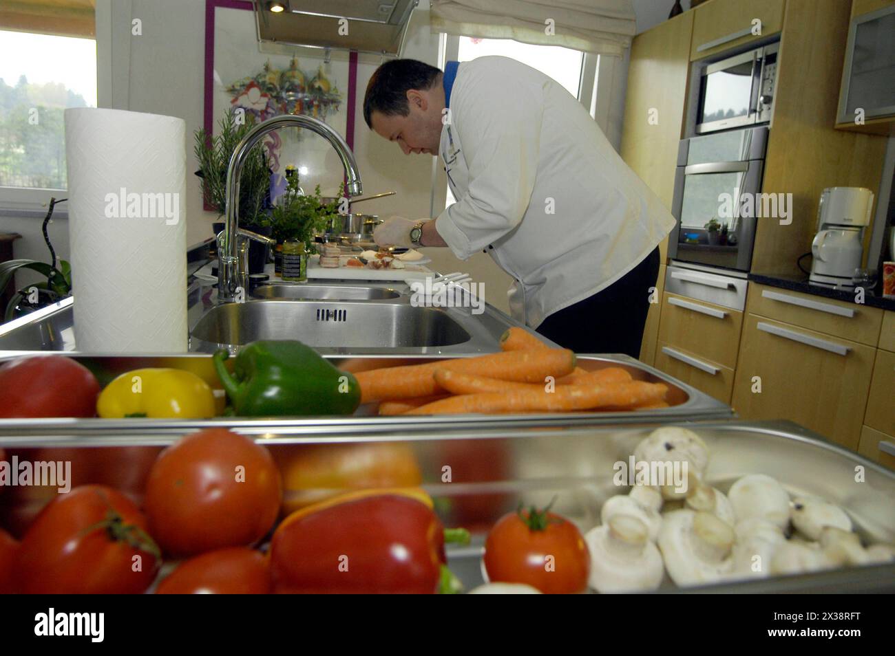 the cook or chef working in the kitchen working in the kitchen Stock ...