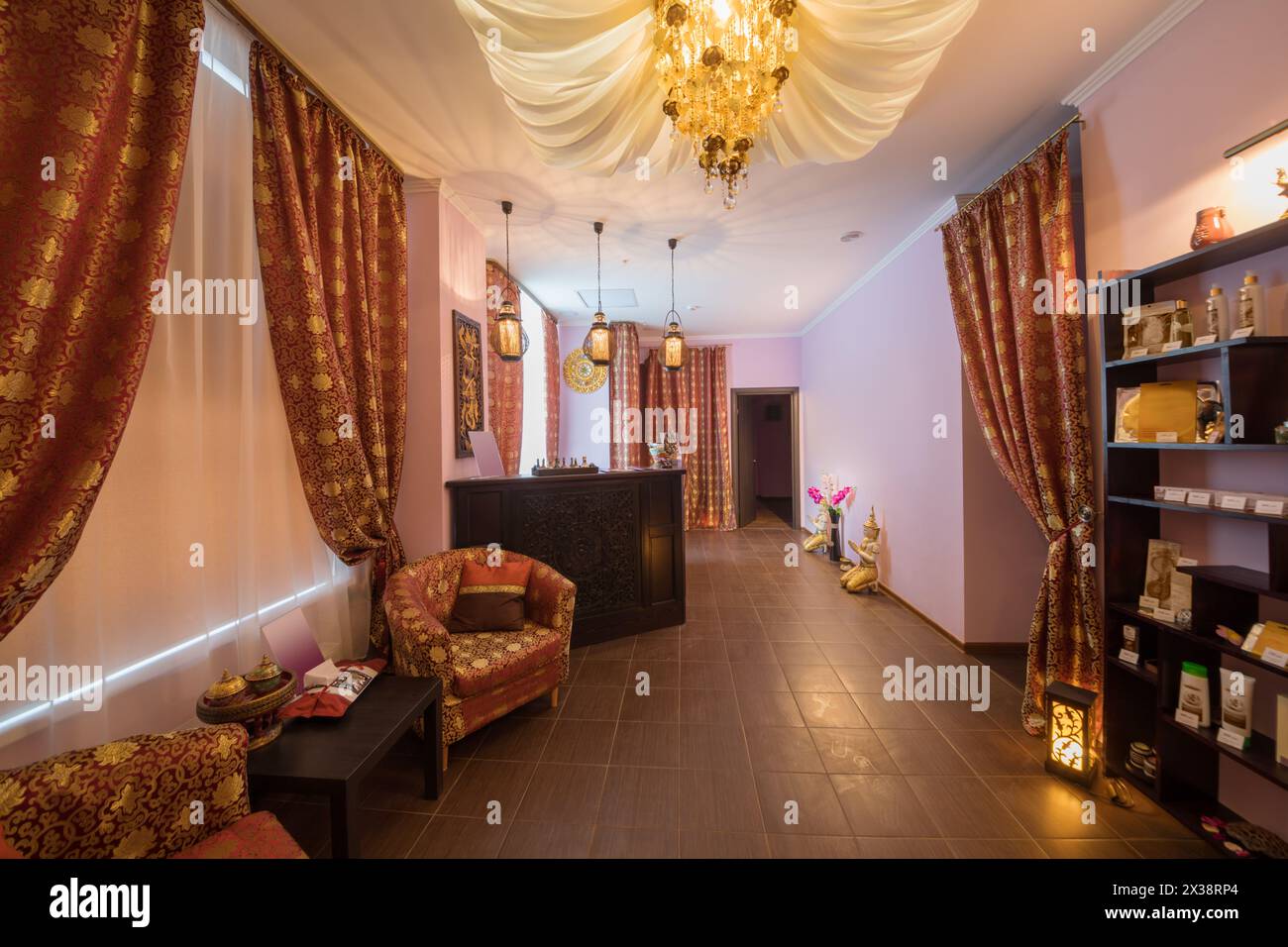 Room with wooden reception in thai day spa with many asian decoration ...