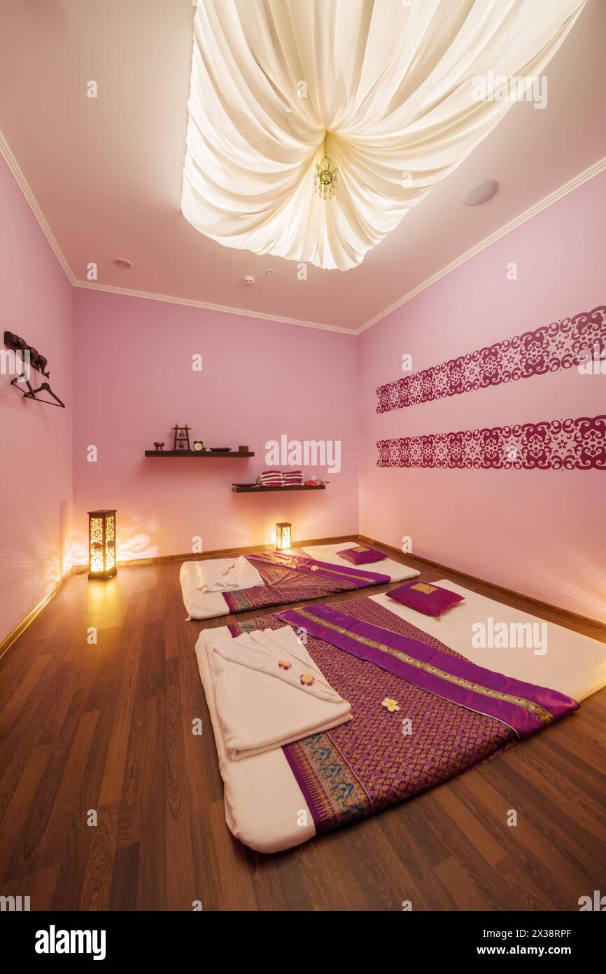 Empty beautiful cozy room with mats for thai massage and canopy top ...