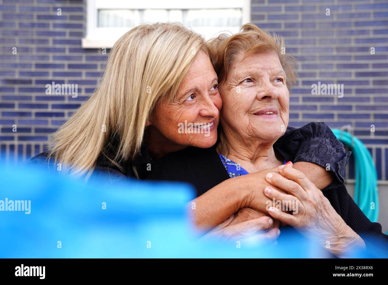 mother and daughter hugging outside. Women family Stock Photo - Alamy