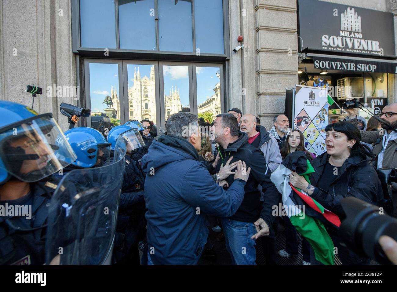 Police face people holding Palestinians flags as they march on the ...