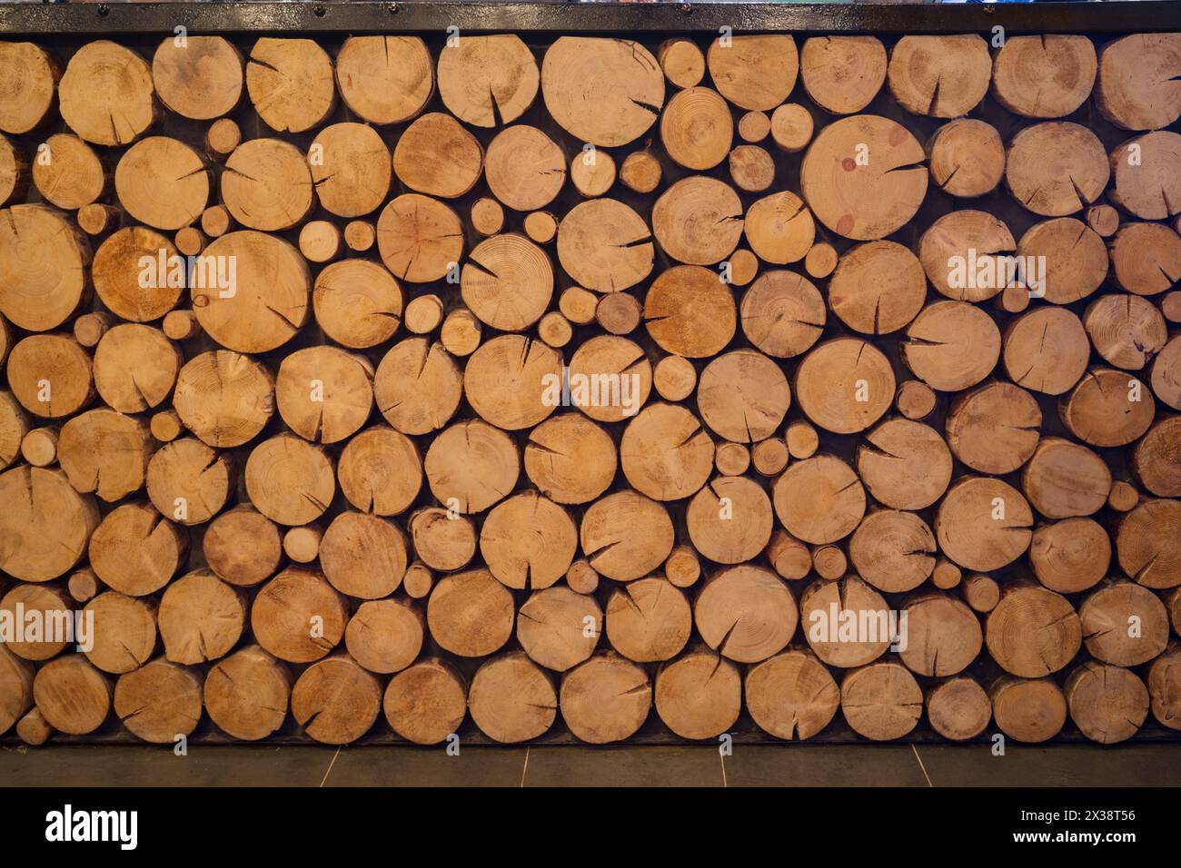 Logs of trees, pile of yellow round wood logs, this is decoration of ...