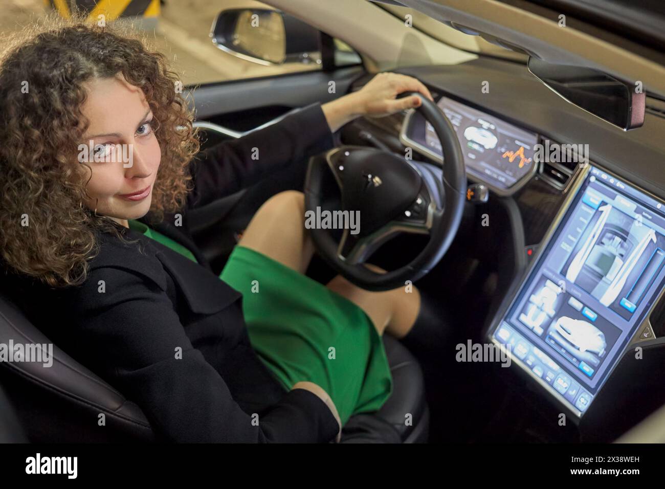 MOSCOW, RUSSIA - NOV 11, 2015: Smiling woman (with model release) sits ...