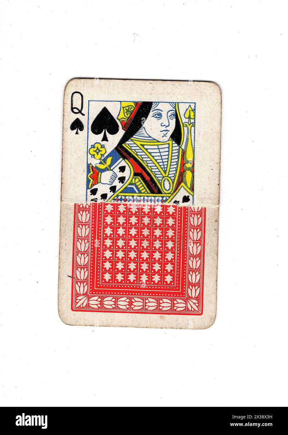 A torn queen of spades vintage playing card showing the front and back ...