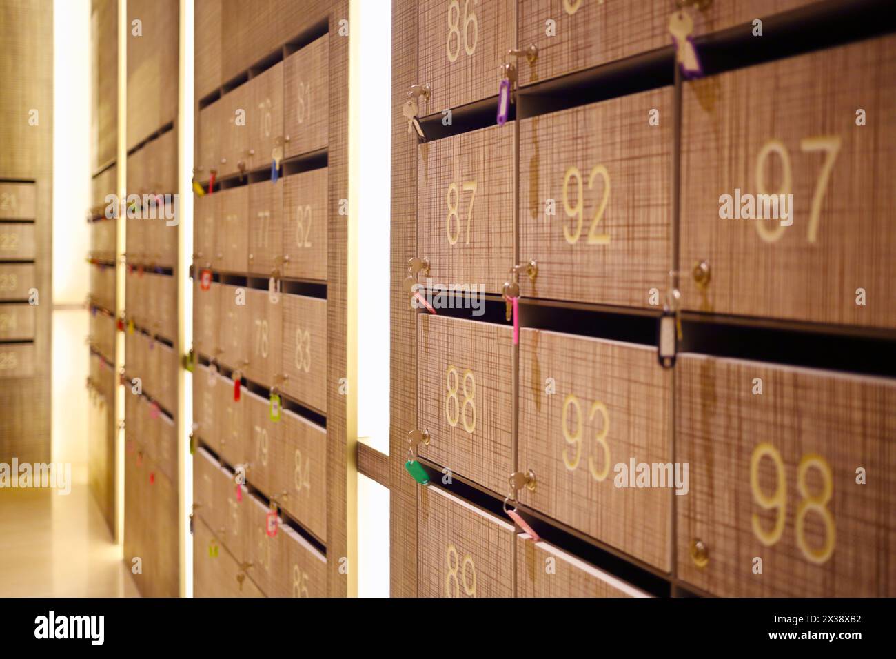 Many new mailboxes with keys and numbers in hall of building Stock ...
