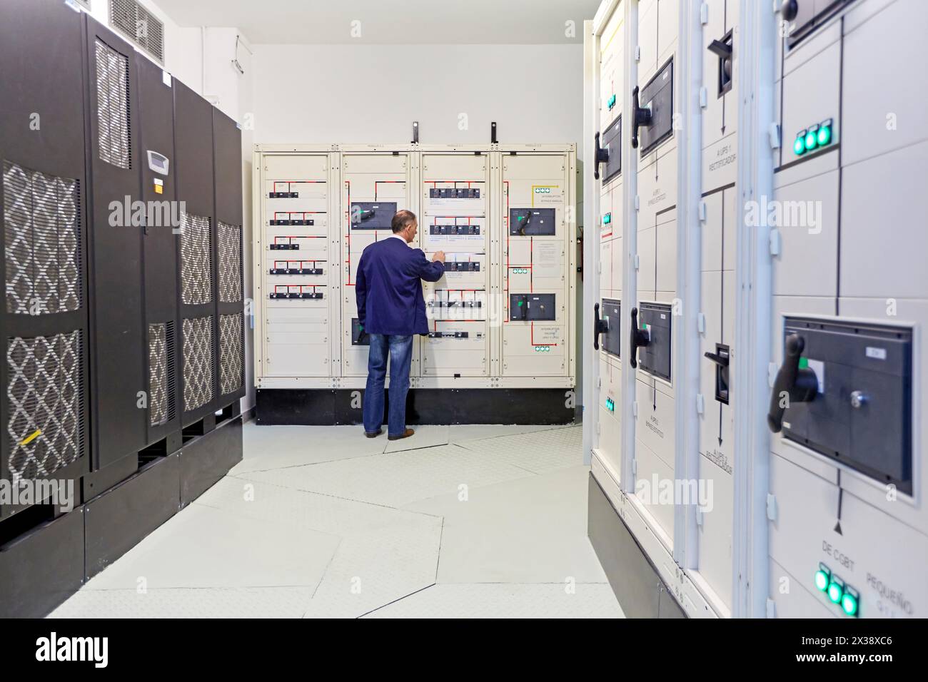 Maintenance worker, UPS, batteries for uninterrupted electricity ...