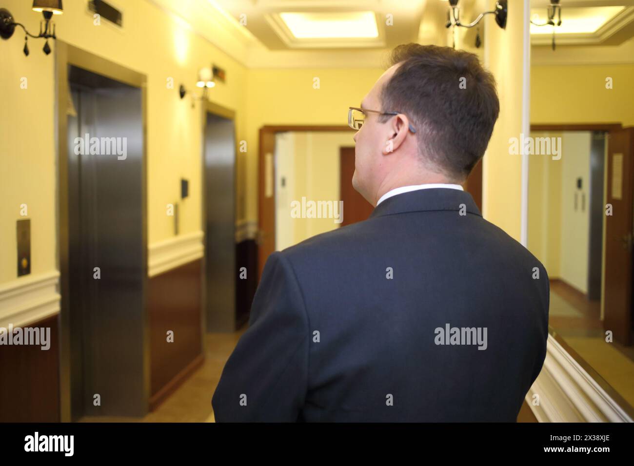 Man stand in an elevator hi-res stock photography and images - Alamy