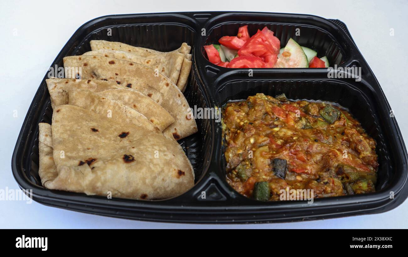 Simple and tasty Indian lunch box consisting of roti ans sabji. Sabzi ...