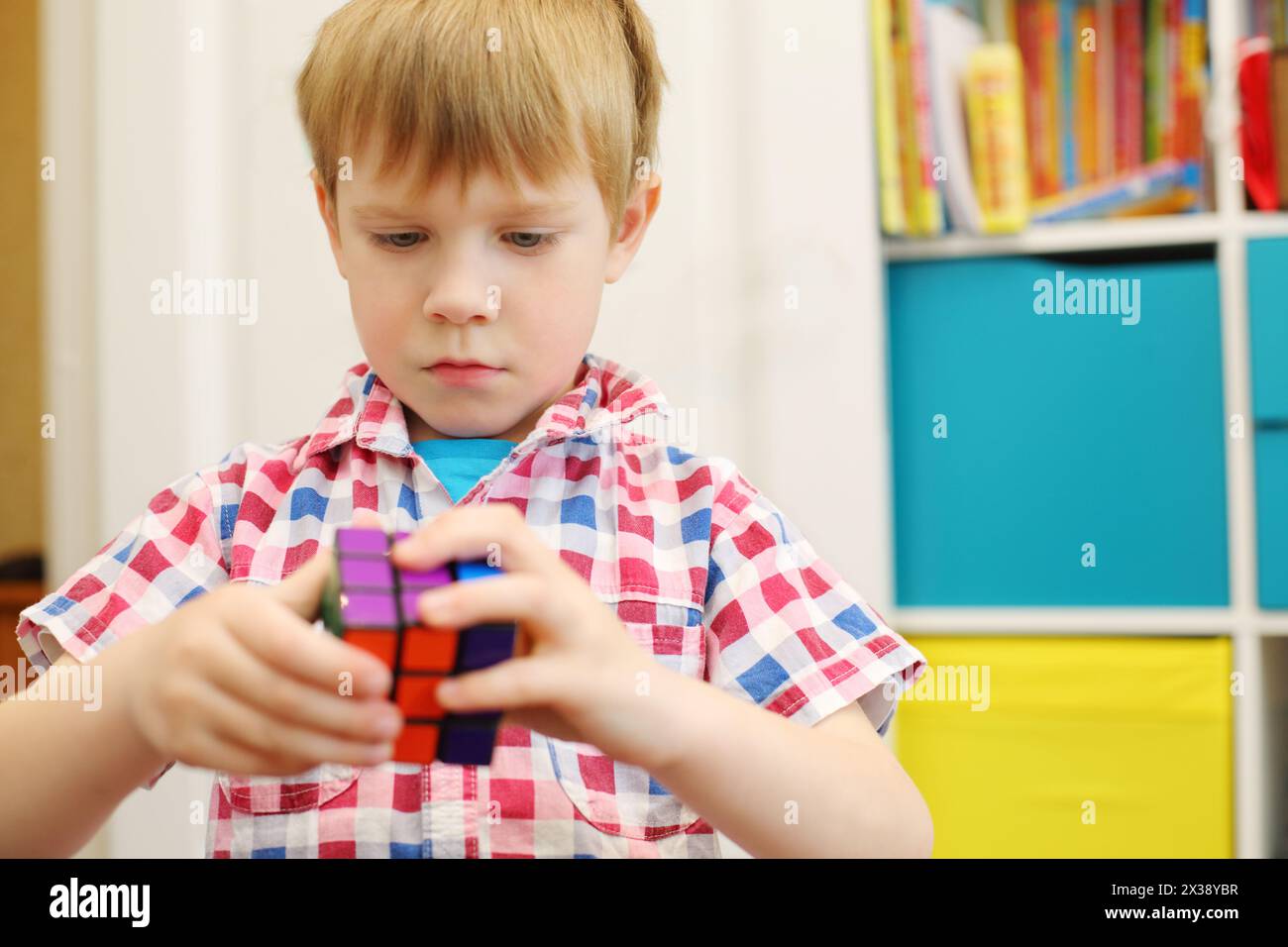 MOSCOW - MAY 7, 2016: Boy (with MR) plays with Rubik Cube. Over 350 ...