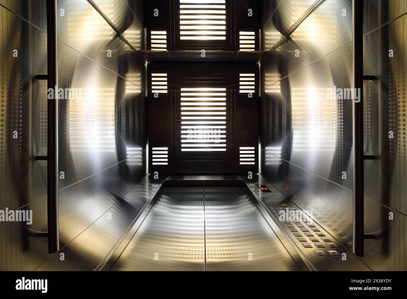 Interior of modern stainless elevator with illumination, under view ...