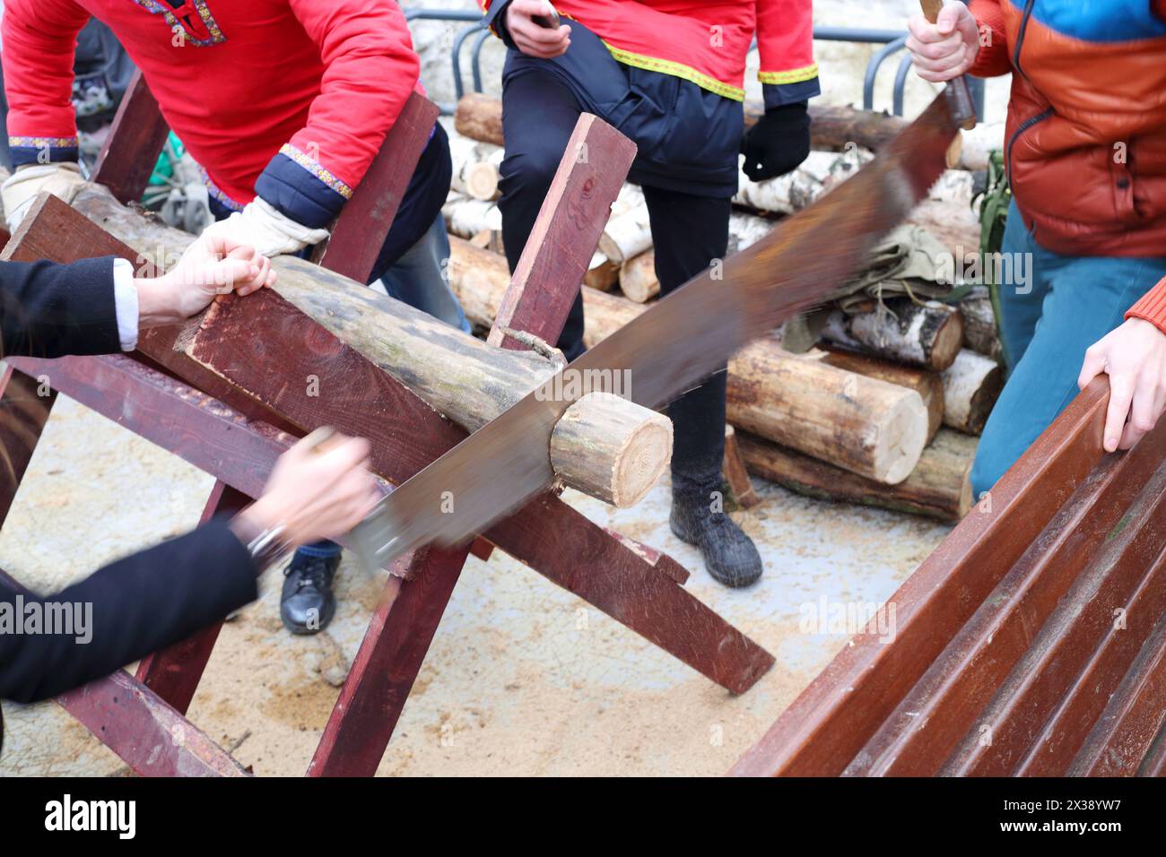 Hands of two men sawn timber at national fair outdoor, noface Stock ...