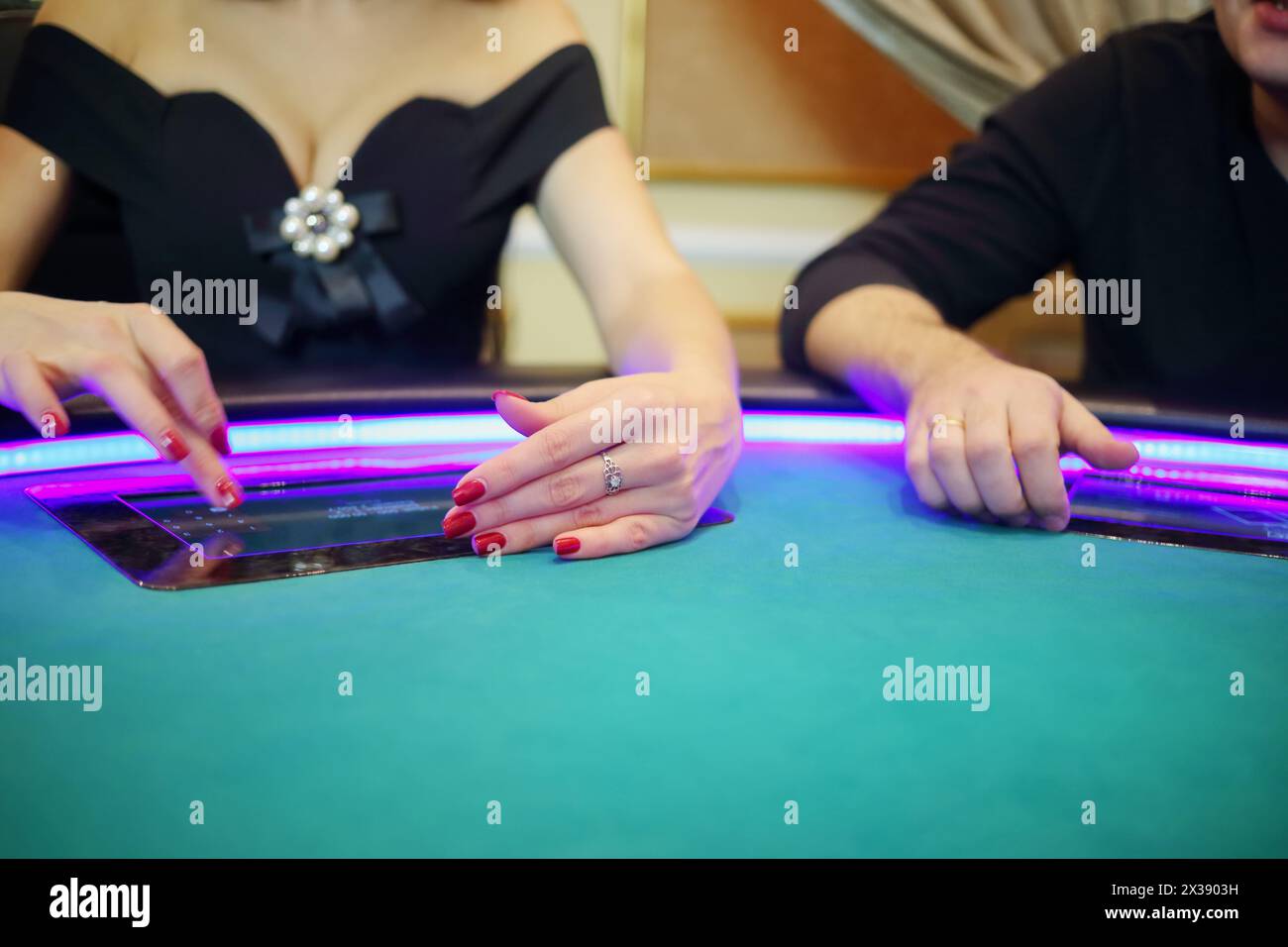 Casino girl with money in hand hi-res stock photography and images - Alamy
