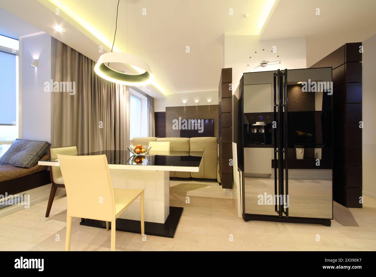 Dining area with a large table and chairs in front of recreation area ...