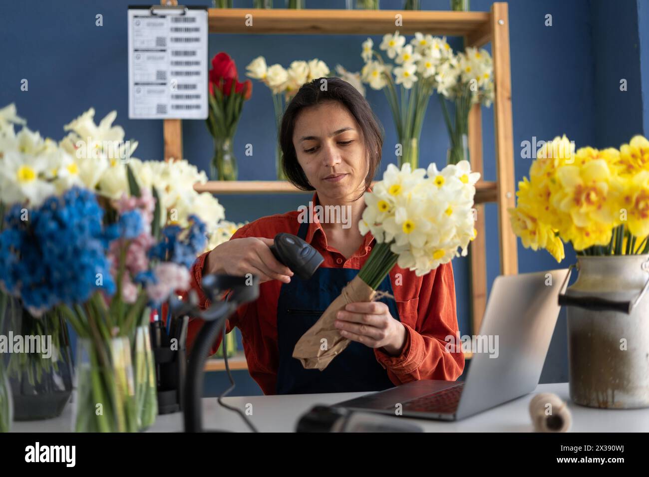 Florist concept. Beautiful hispanic woman entrepreneur working at own ...