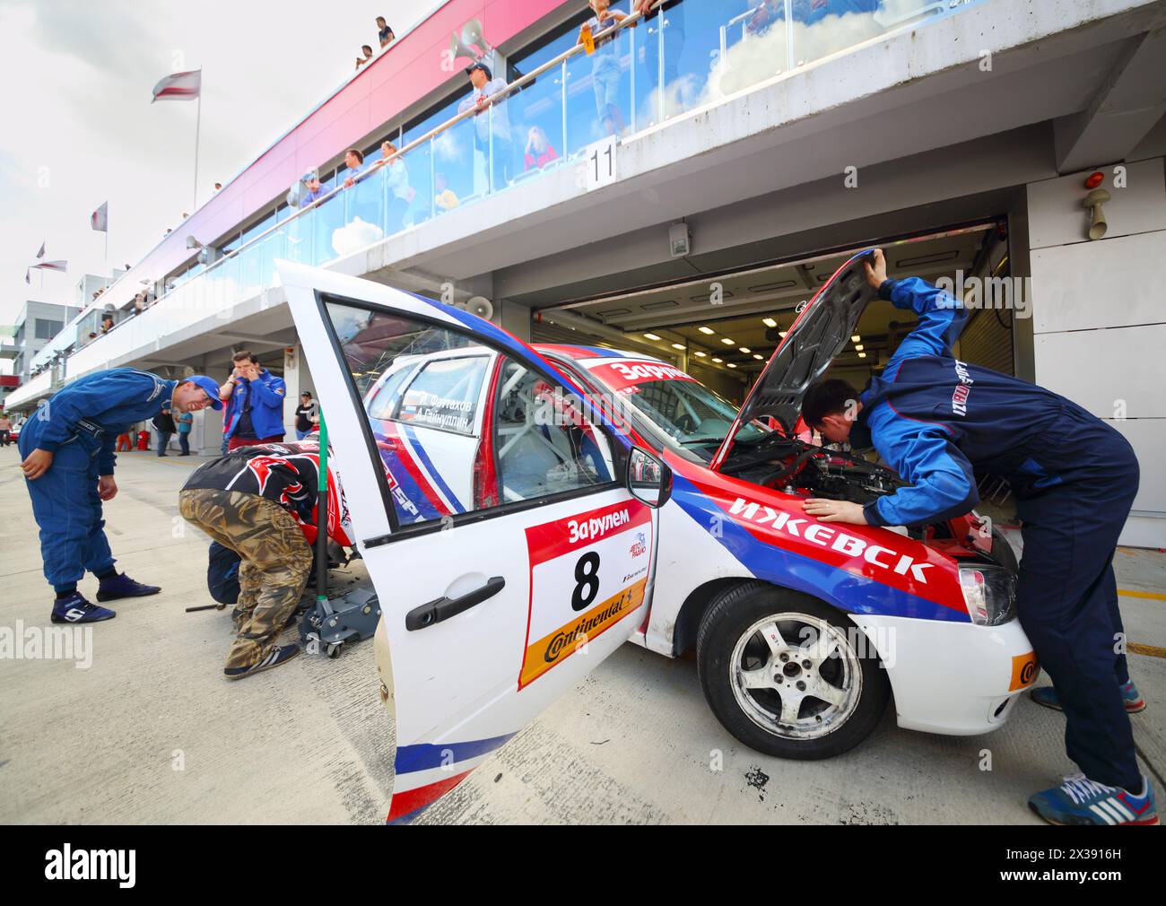 MOSCOW - SEP 3, 2016: Mechanics near car during Race of Stars At wheel ...