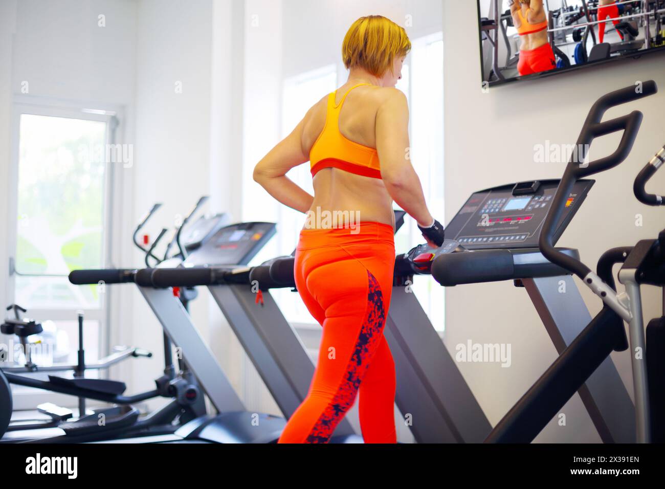 Back view girl on treadmill hi-res stock photography and images - Alamy