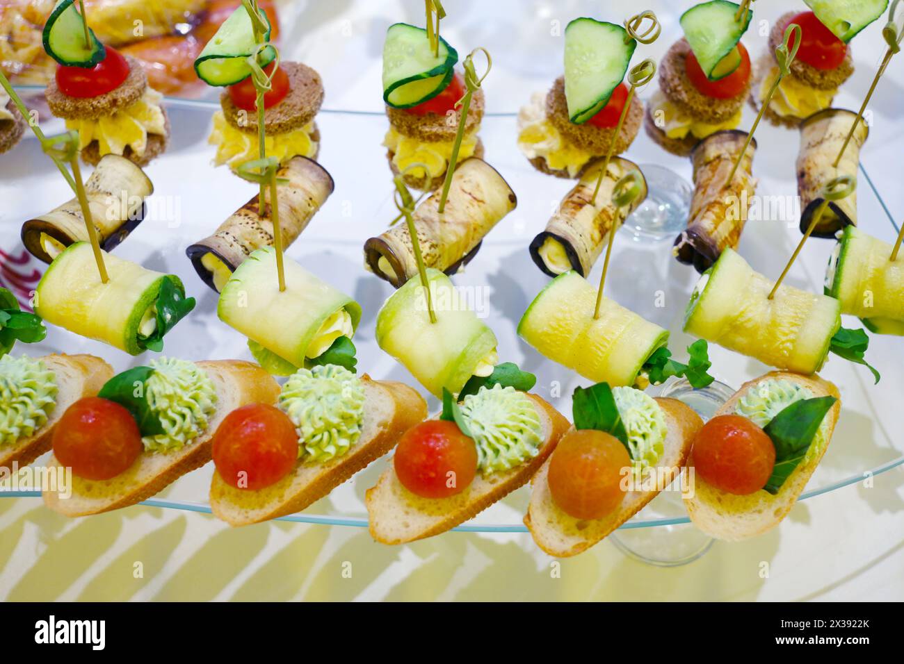 Different canapes - cold appetizers are on table with white cloth Stock ...