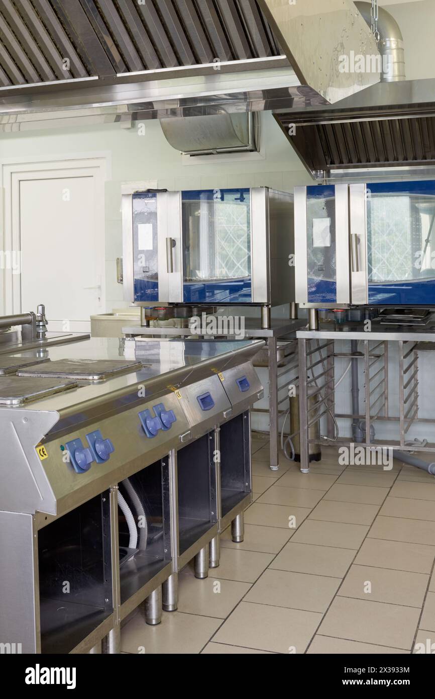 Kitchen room with stoves, heat ovens and refrigerators in restaurant ...