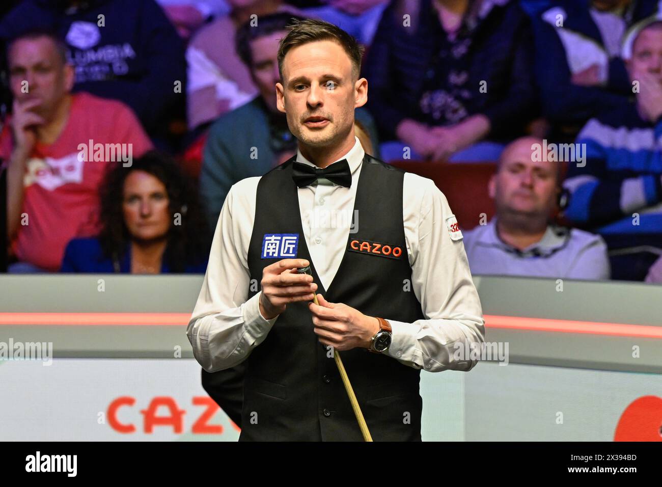 David Gilbert chalks his cue, during the Cazoo World Championships 2024 ...