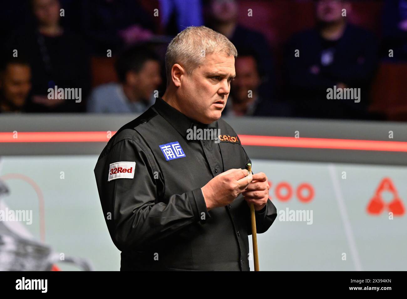 Robert Milkins chalks his cue, during the Cazoo World Championships ...