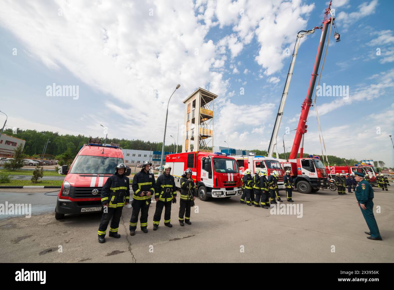 RUSSIA, MOSCOW - MAY 29, 2015: Firemen with fire trucks stand on ...