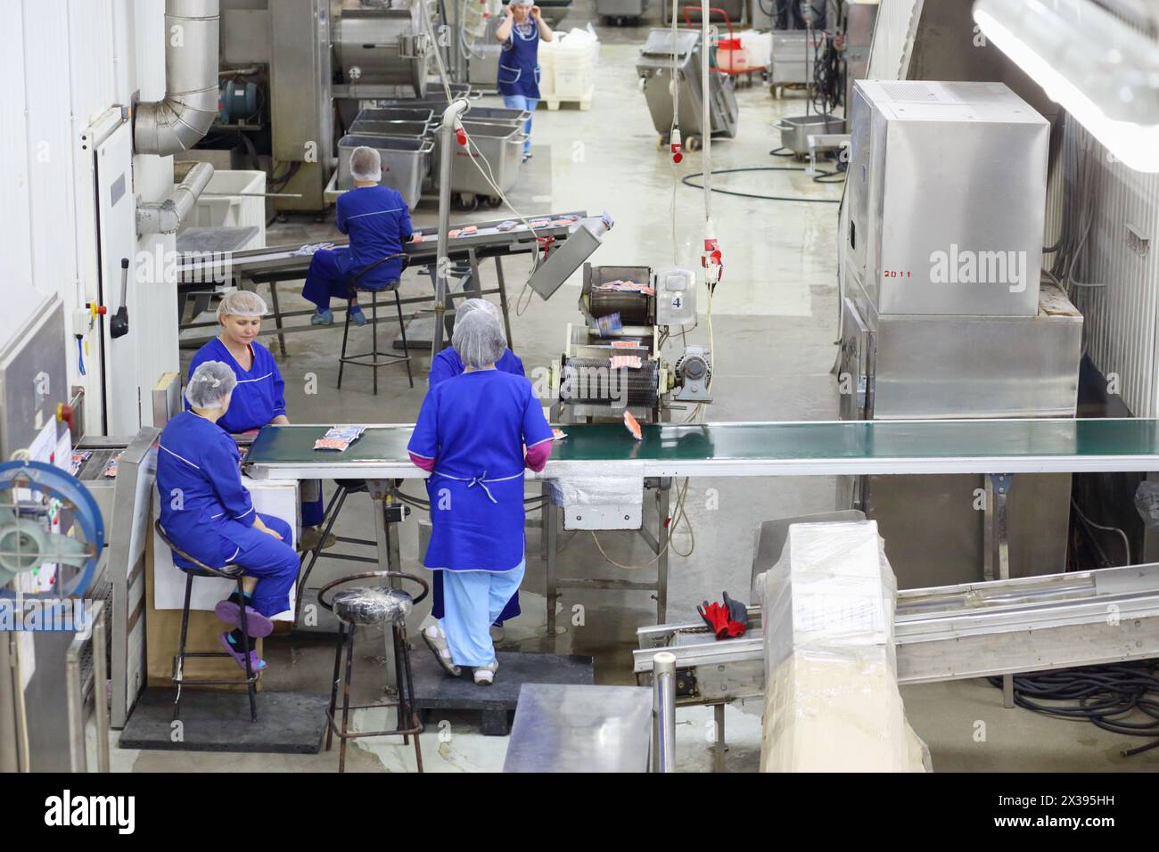 MOSCOW, RUSSIA - APR 28, 2016: (top view) Women workers near production ...