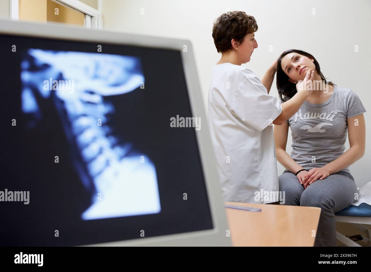 Doctor checking neck tilt, Cervical X-ray image, Physiotherapy medical ...