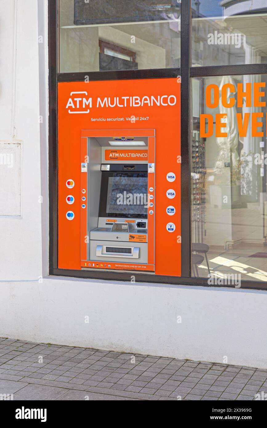 Craiova, Romania - March 16, 2024: Bright Orange Multibanco Bank Atm ...