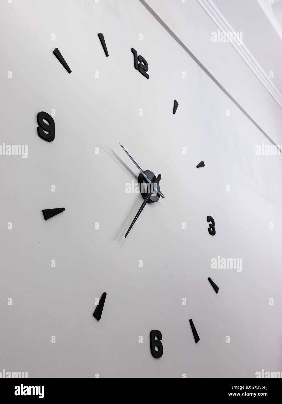 Minimalistic design of wall clock with black numbers Stock Photo - Alamy