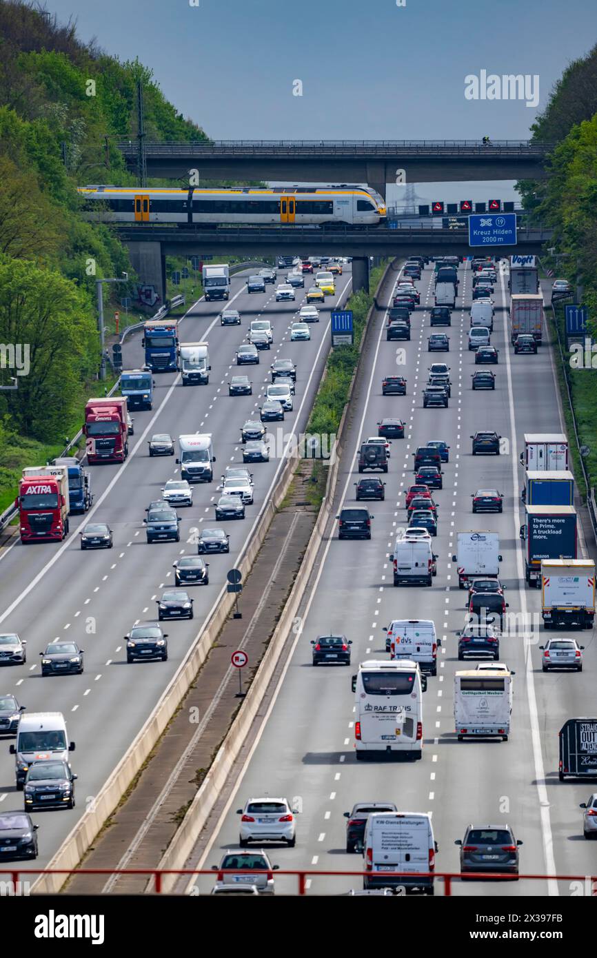 Eurobahn train, crossing the highway A3, traffic on 8 lanes, incl. the ...
