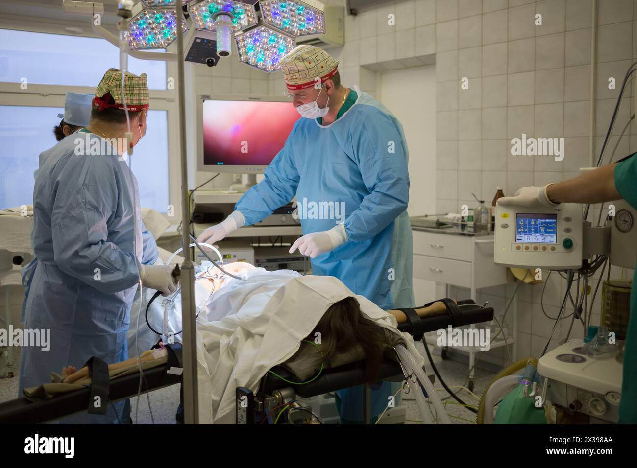 RUSSIA, MOSCOW - 01 SEP, 2015: Doctor with assistants are doing surgery ...