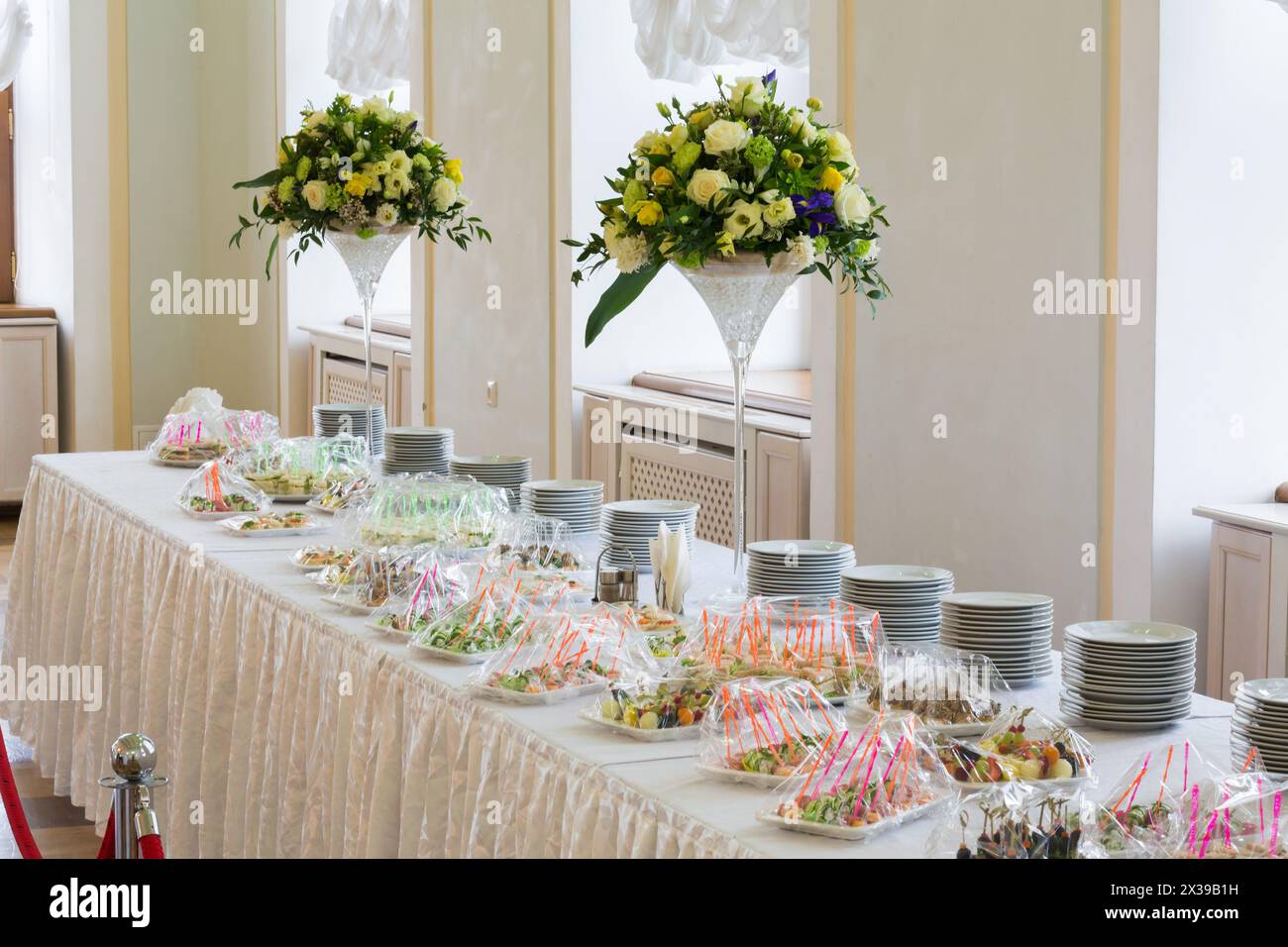 Cold table with many food and decorated flowers bouquet Stock Photo - Alamy