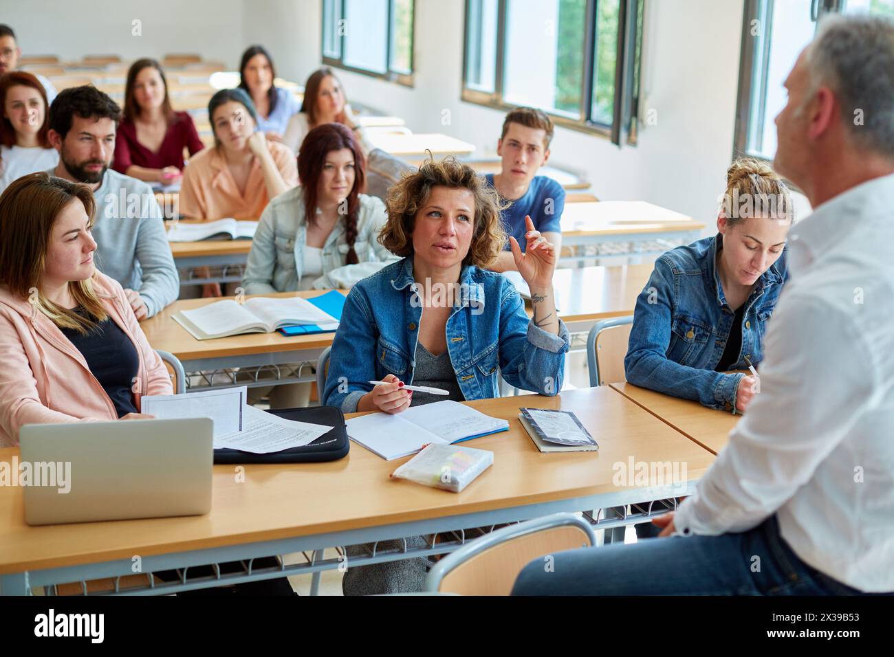 Teacher with students. Classroom. College. School of Business Studies ...