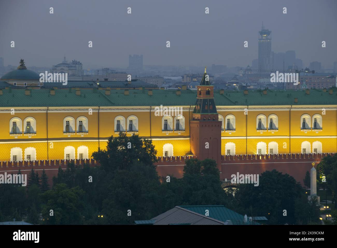 Part of Arsenal building and red Kremlin wall with illimination at ...