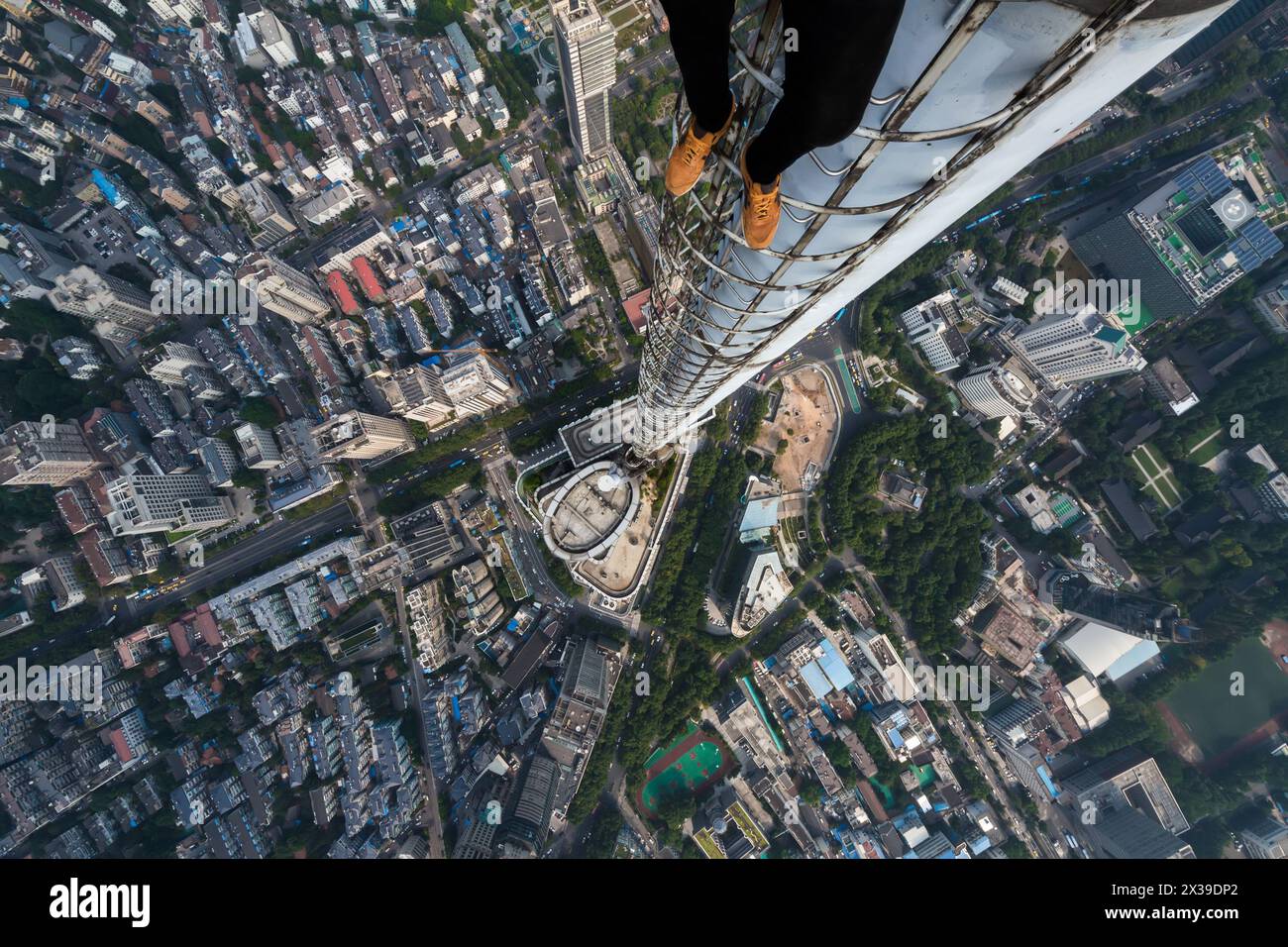Skyscrapers, office buildings roofs, roofer legs in Hong Kong city ...