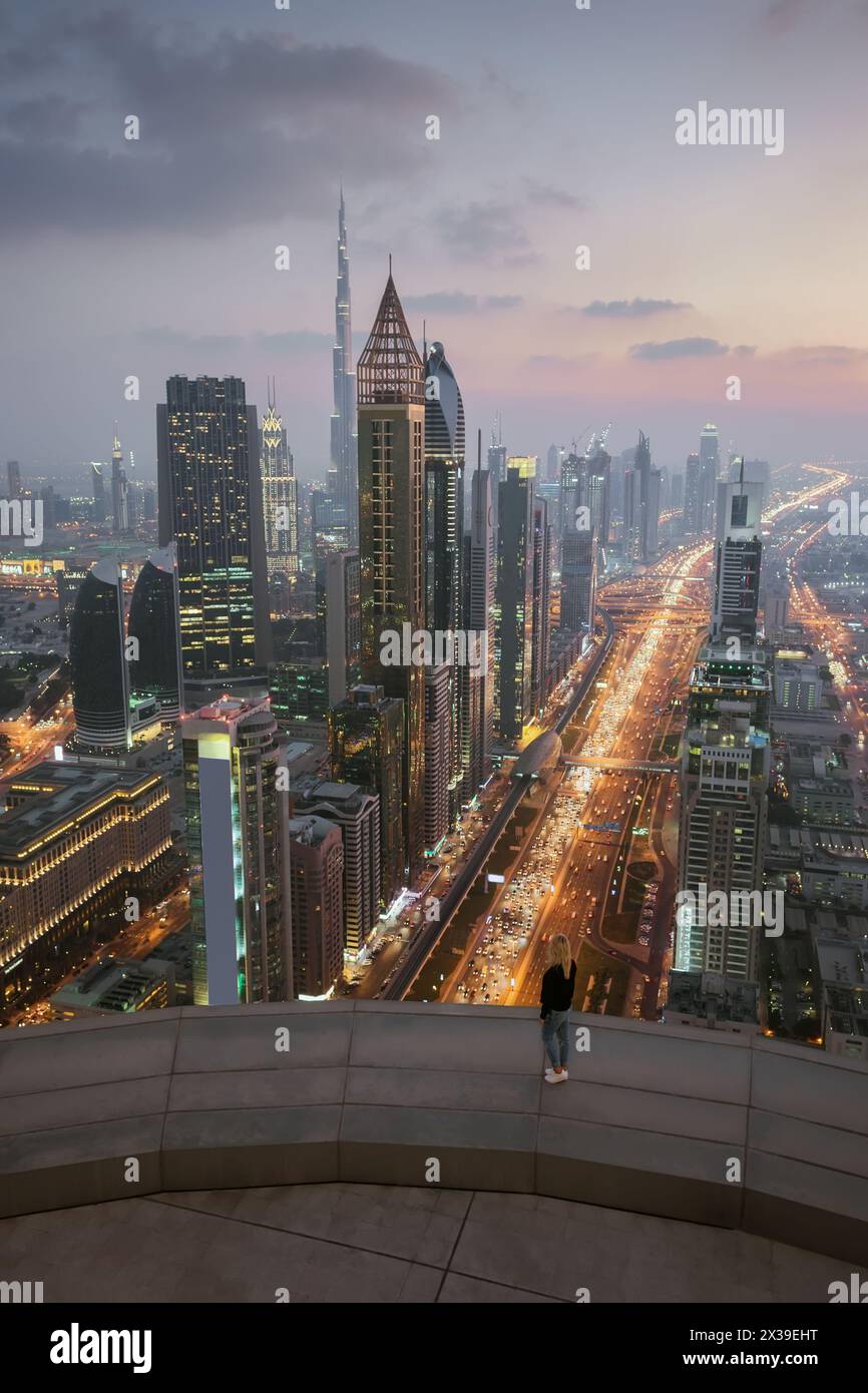 Woman on rooftop, Sheikh Zayed Highway, Burj Khalifa, Rose Rayhaan by ...