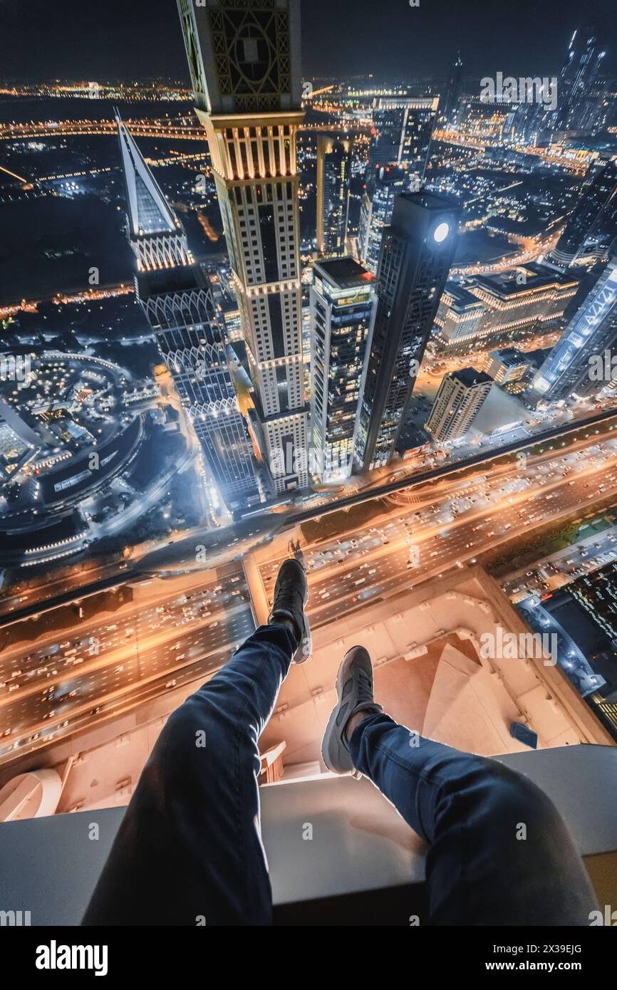 Male legs of rooftop of Millennium Plaza Hotel Dubai on Sheikh Zaid ...