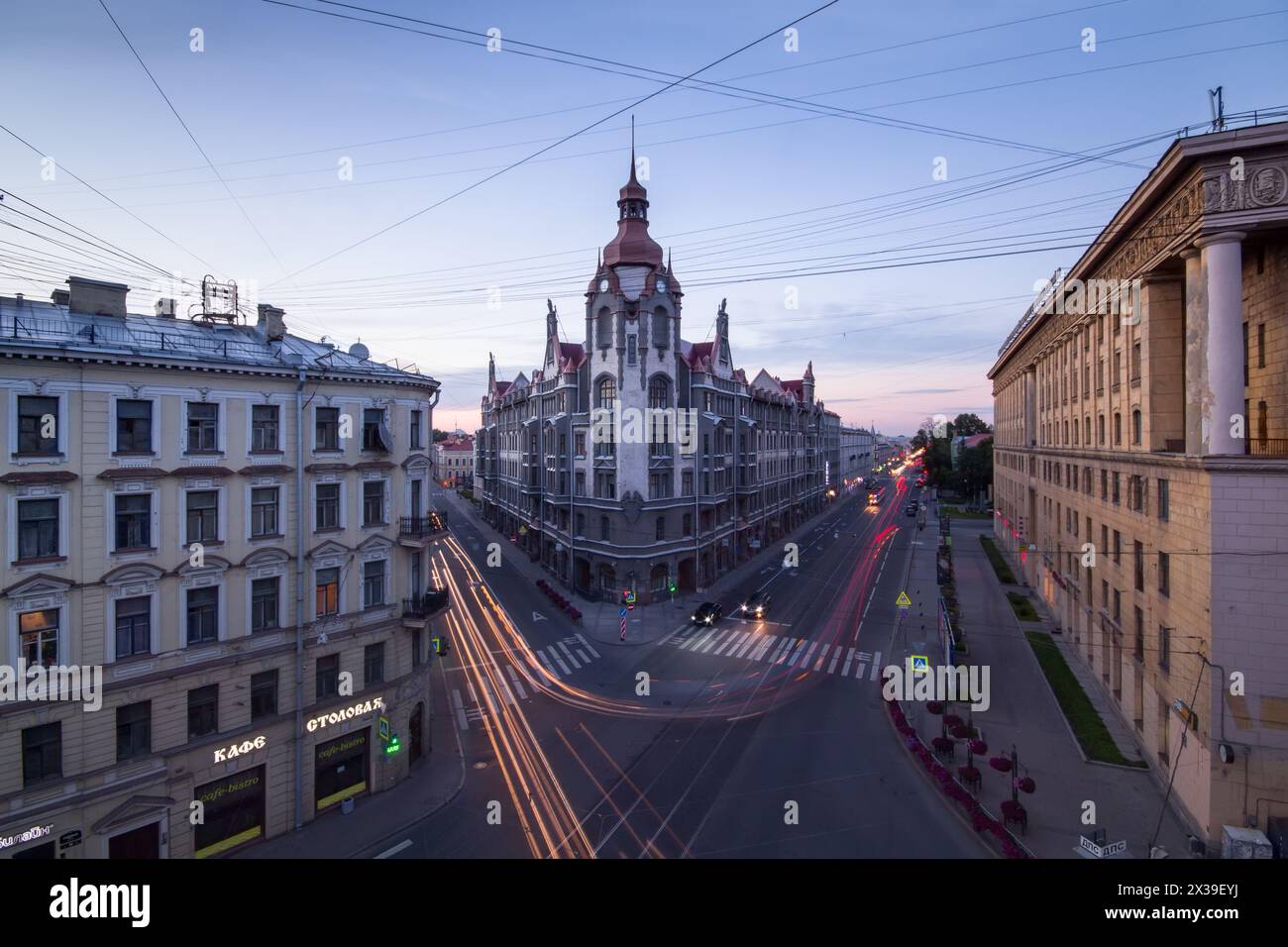 ST. PETERSBURG, RUSSIA - JUNE 22, 2015: Building with spire at corner ...