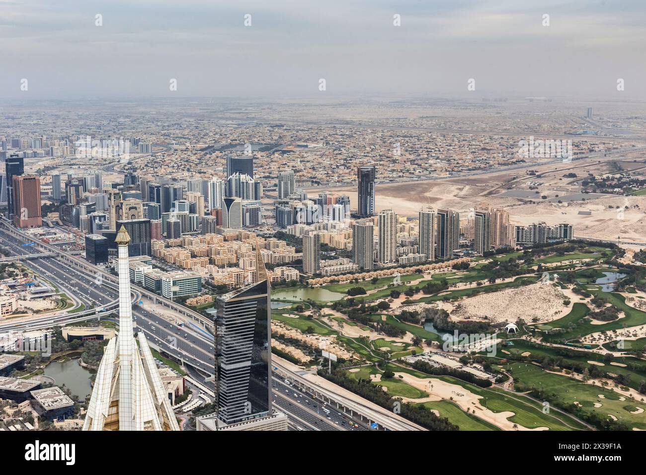 Emirates Golf Club, hotels and residential areas far away in desert in ...