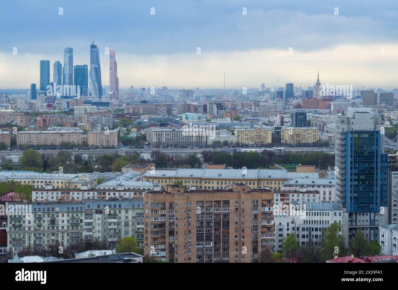 Roofs of buildings in sleeping area and skyscrapers in Moscow, Russia ...