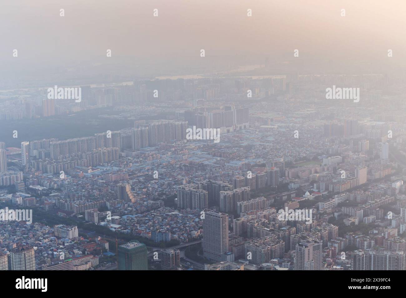 Big residential area in modern Guangzhou city in mist, China Stock ...