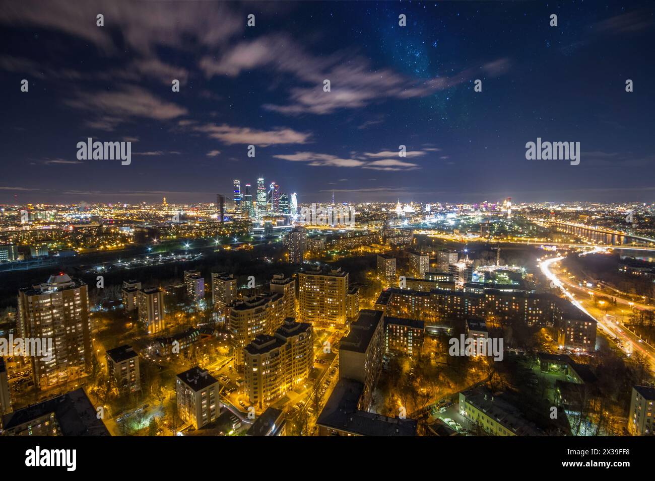 Night view of residential district with illumiantion and starry sky in ...