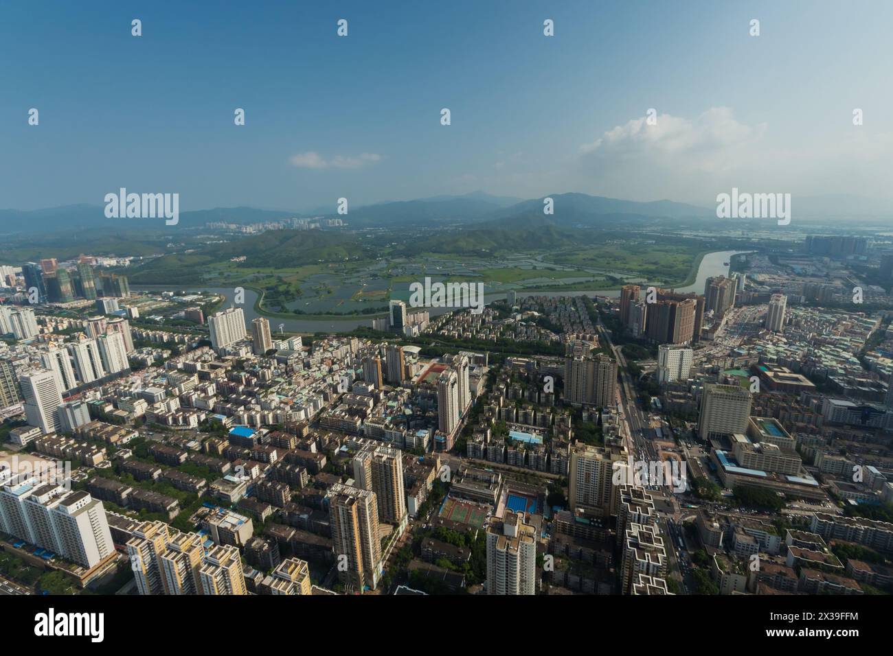 Rice plantations, residential area of Shenzhen city at sunny day, view ...