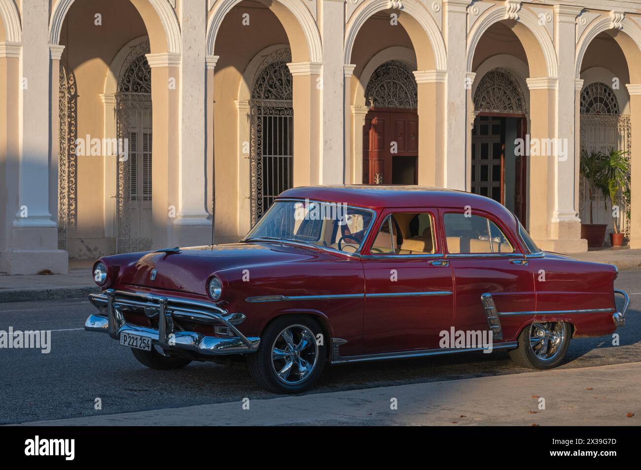 Restored classic American car parked on the roadside in front of ...